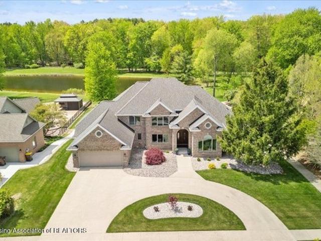 410 W Spring Meadows Ln, DeWitt, MI 48820