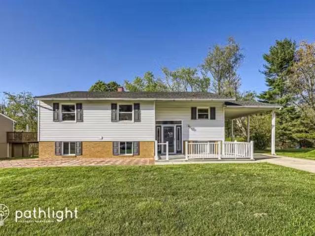 4 bedroom 2 full bath split foyer home in the Cran 115 Charge.