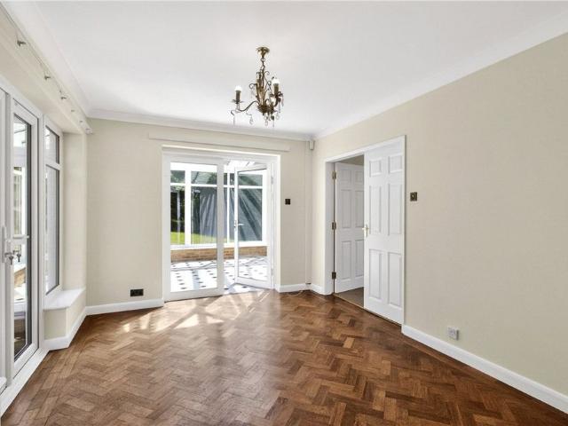 4 bedroom detached house with a double garage, drive and surrounding gardens