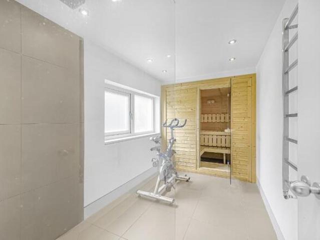 4 bedroom house for sale in Curzon Park North home with private mere frontage, refined interiors, gym, sauna and a south facing garden retreat. CH4