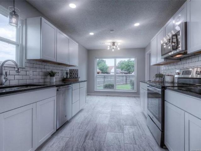4 Br, 2 bath, Single Family 5926 S 90th East Ave