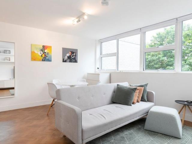 4th floor apartment with lift, access to 2 acres of tranquil woodland gardens in a gated secure development, ziggurat pyramid style architecture, 50 metres from Hyde Park
