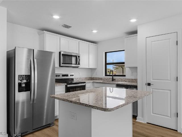 521 NW 23rd St, Cape Coral, FL 33993 | MLS #2025008 | Compass