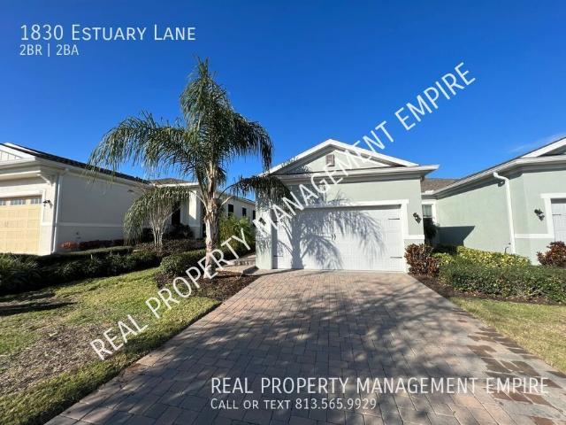 55+ community in Four Seasons of Orlando 2 bedroom, 2 bathroom, with a 2 stall attached garage on a golf course