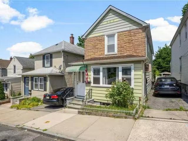 63 WOODBURY ST, NEW ROCHELLE, NY 10805 Single Family Residence.