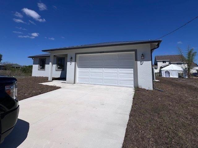 617 Chestnut St E, Lehigh Acres, FL 33974
