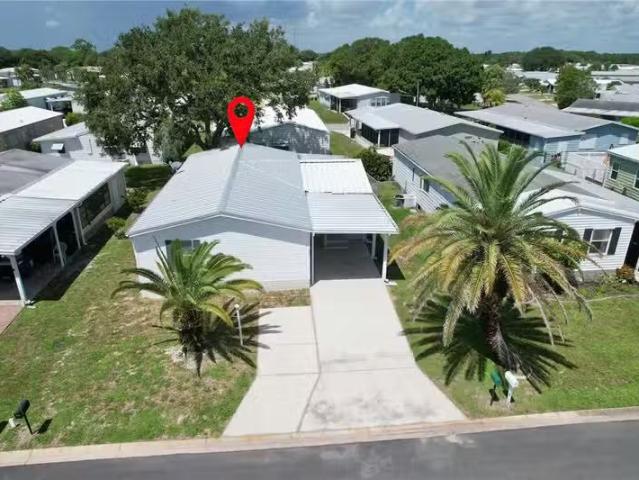 707 HYACINTH CIR, BAREFOOT BAY, FL 32976 Manufactured On Land.