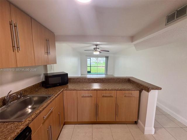 8060 N Colony Cir, Unit 107, Tamarac, FL 33321 | MLS #A12057
