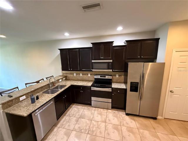 8827 Turnstone Haven Pl, Tampa, FL 33619 | MLS #TB8492 | Compass