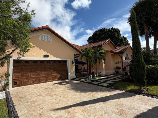 9050 Cypress Hollow Dr, Palm Beach Gardens, FL 33418 | MLS #R11153 | Compass