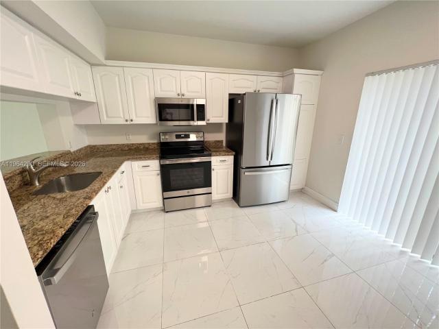 9820 NW 56th Pl, Coral Springs, FL 33076 | MLS #A11964 | Compass