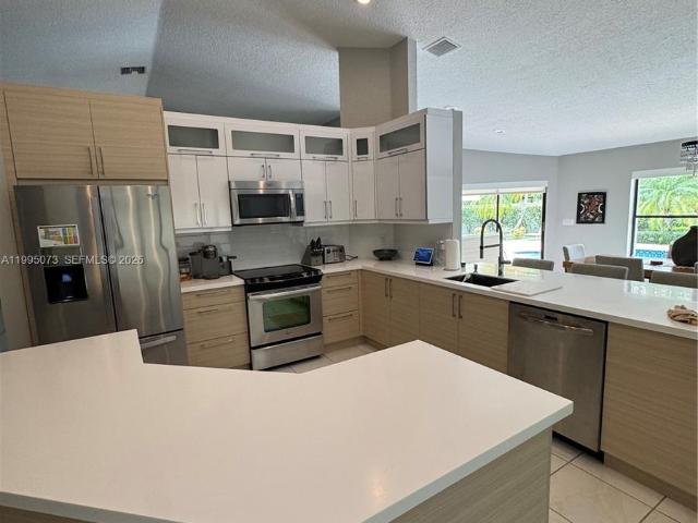 11021 NW 7th St, Plantation, FL 33324 | MLS #A11995 | Compass