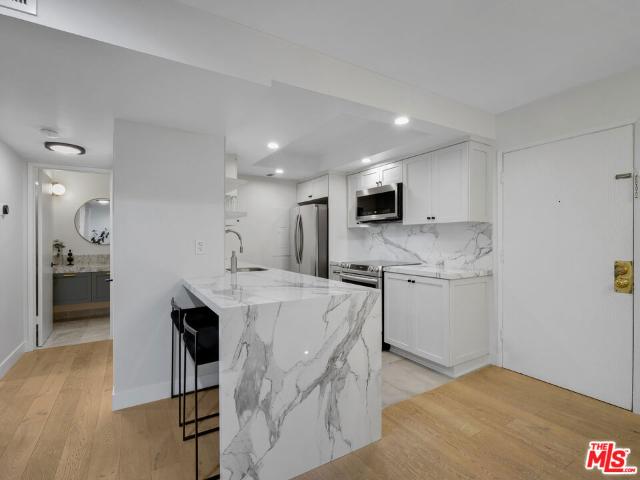 1134 Alta Loma Road 203