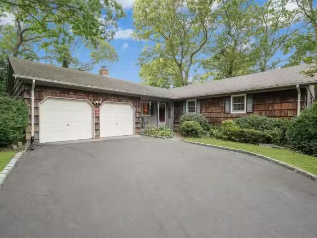 11 WOODLAND RD, MILLER PLACE, NY 11764 Single Family Residence.