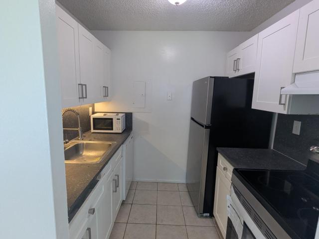 1203 Benoist Farms Rd, Unit 107, West Palm Beach, FL 33411 | MLS #B26009