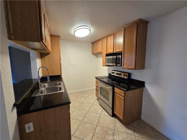 1345 Cabrillo Park Dr, Unit E01, Santa Ana, CA 92701 | MLS #OC26095