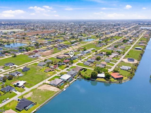 1413 NW 8th Pl, Cape Coral, FL 33993 | MLS #2026015 | Compass