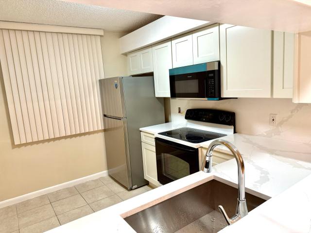 1502 Whitehall Dr, Unit 104, Davie, FL 33324 | MLS #F10517 | Compass