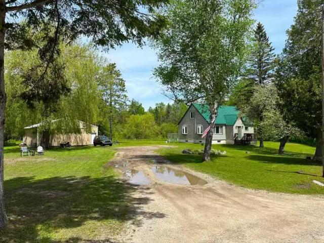 1912 CHARLES MORAN RD, MORAN, MI 49760 Single Family Residence.
