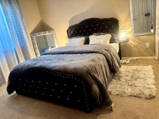 1 furnished bedroom with a full bathroom