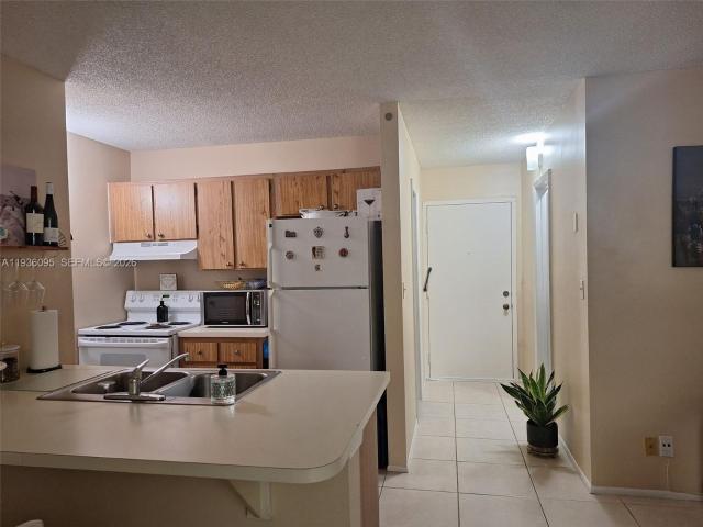 2701 Riverside Dr, Unit 202B, Coral Springs, FL 33065 | MLS #A11936 | Compass