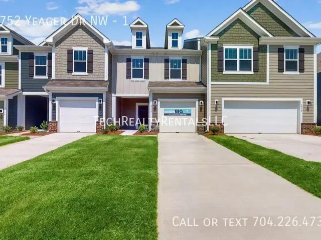 2752 Yeager Dr NW, 3 beds, 2 full and 1 half baths