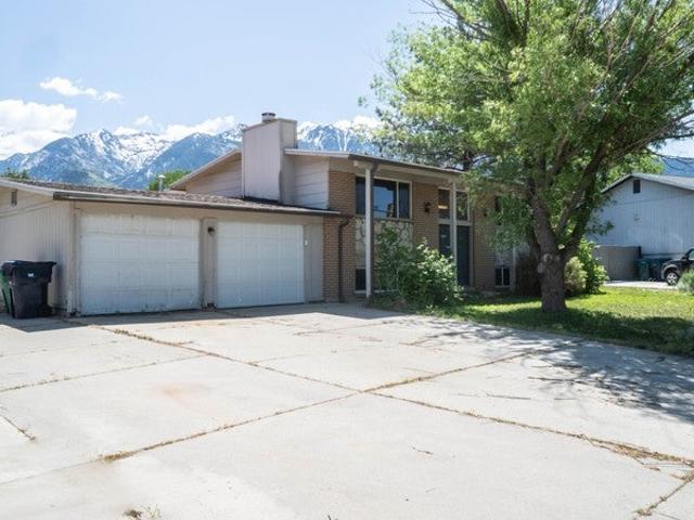 2 BR Upstairs with 2 car garage and back yard