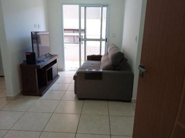 2 Dormitórios sendo 1 suíte, semi mobiliado, com varanda, perto da praia!