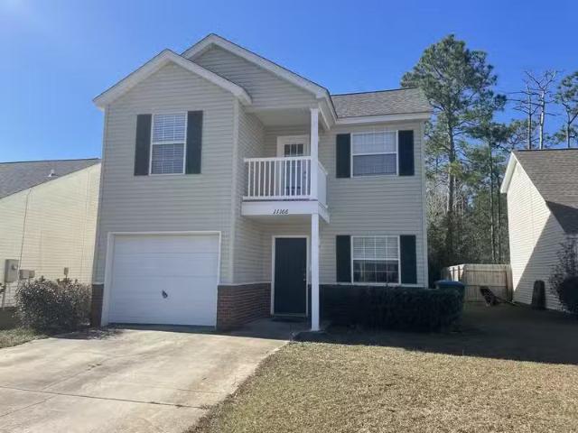 2 story 3 bed room, 2.5 bathroom home with garage and balcony.