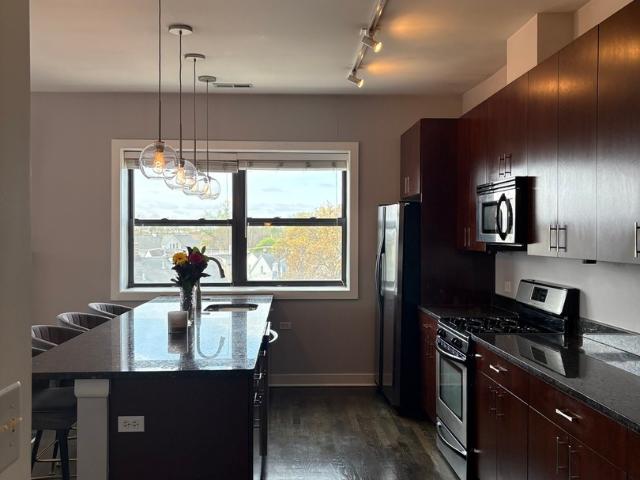 3028 W Roscoe St, Unit 406, Chicago, IL 60618 | MLS #12620 | Compass