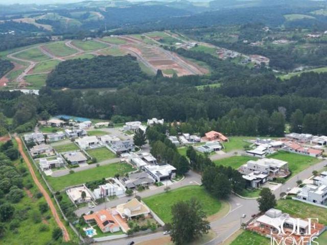 Terra Caxambu Terreno com fundo para o lago e vista da mata em condomínio fechado no Terra Caxambu