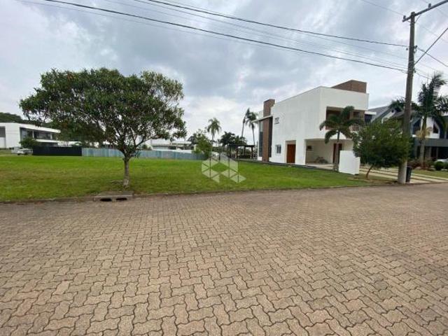 TERRENO NO CONDOMINIO SERRA AZUL COM FUNDOS PARA O LAGO