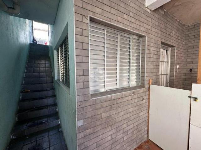 terreno com 5 casas e um salão comercial á venda por R$ 550.000,00