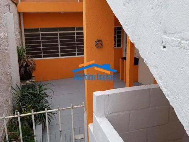 Terreno com 6 Casas e Renda: Oportunidade de Investimento