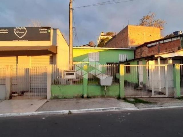 Terreno com 2 casas Bairro Olaria