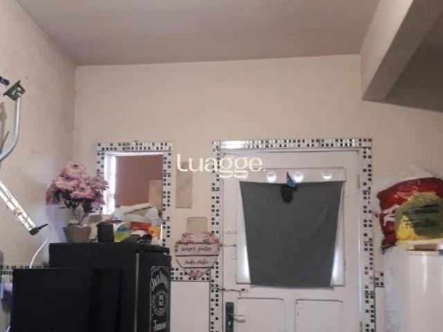 Terreno com 2 casas de Alvenaria