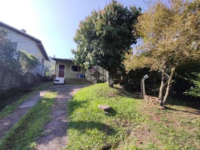 Terreno com 3 casas em Estância Velha