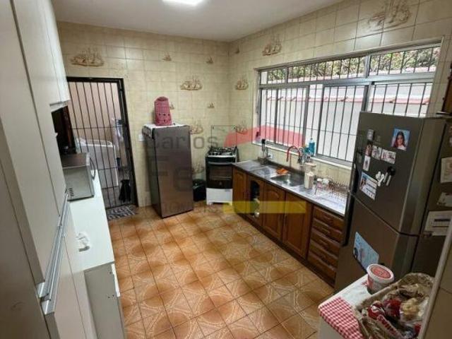 Terreno com 3 casas em Santana
