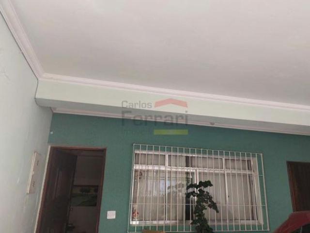Terreno com 3 casas em Santana