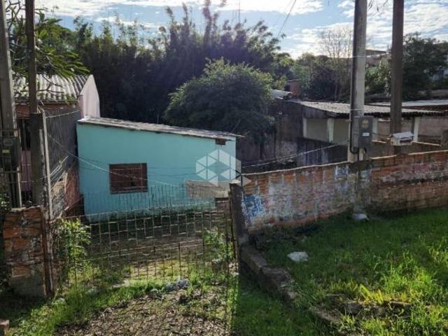 Terreno com 3 casas