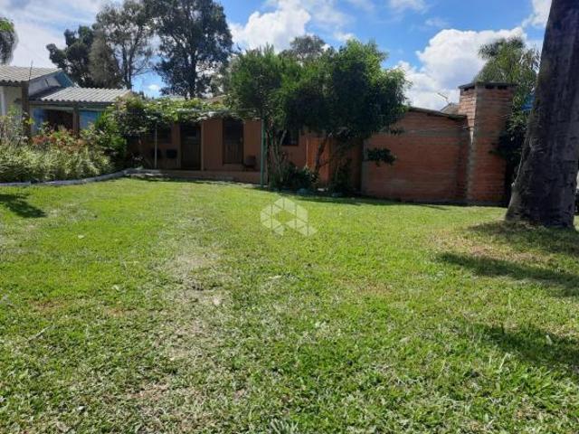 Terreno com casa no Bairro Santa Helena