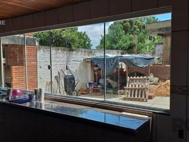 Terreno com casa com 3 quartos, vaga de garagem, no bairro Ipanema, Porto Alegre