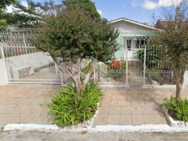Terreno com casa de madeira