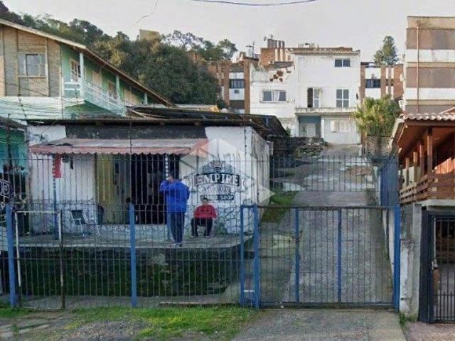 Terreno com casa de 306m2 dividida em 5 apartamentos, todos alugados!