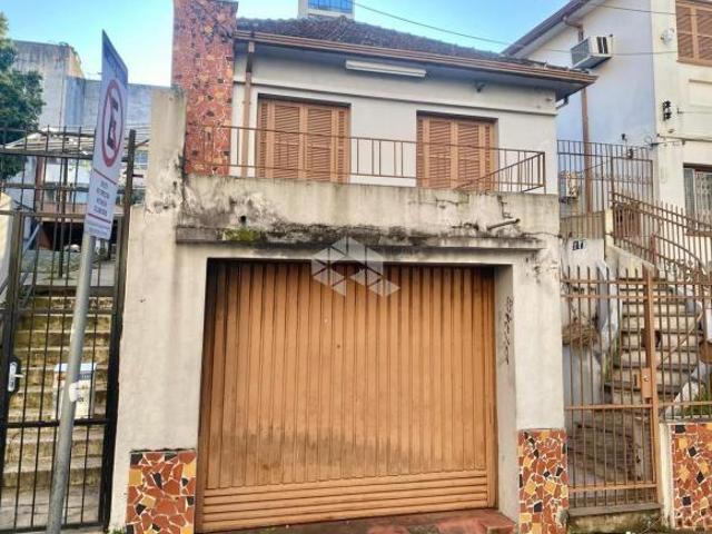 Terreno com casa e 02 apartamentos a venda no bairro Centro