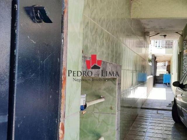 Terreno com casas velhas na Penha