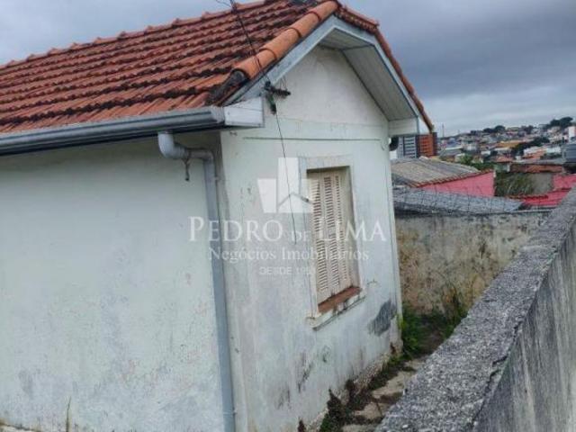 Terreno com duas casas na Vila Ré