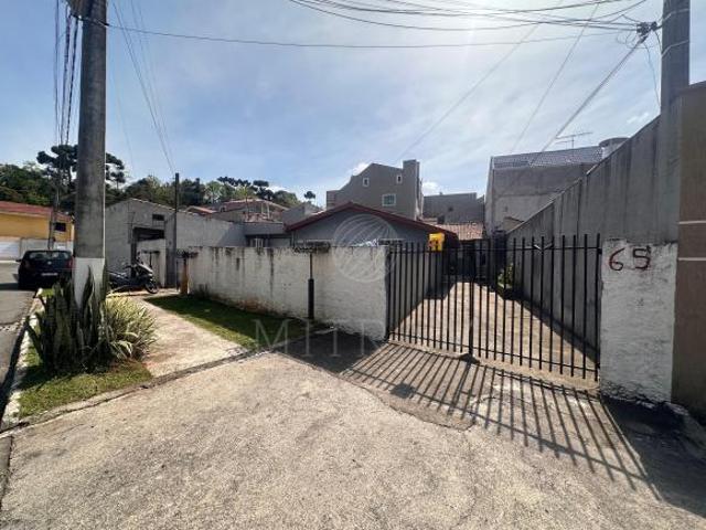 Terreno com duas casas alugadas no Santa Candida