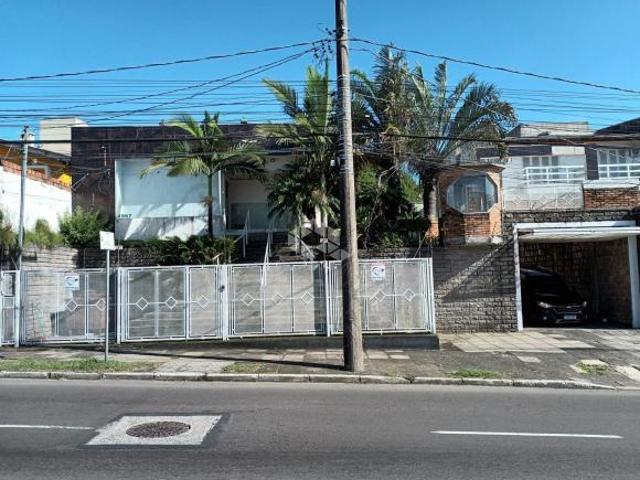 Terreno comercial com casa Av. Cavalhada 4967