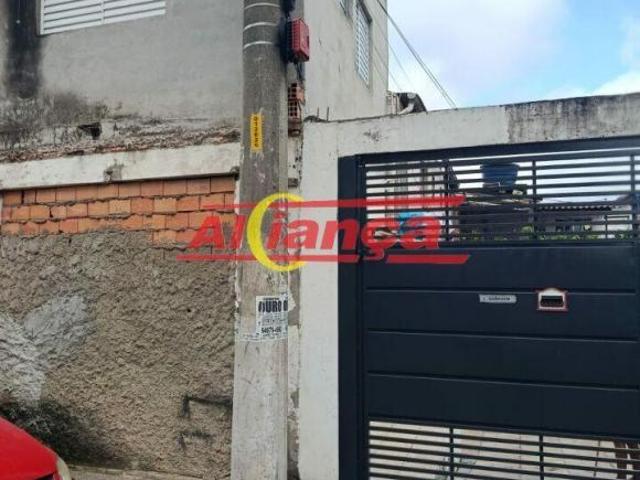 Terreno de 250 m² com casas construídas no Jardim Cidade Seródio